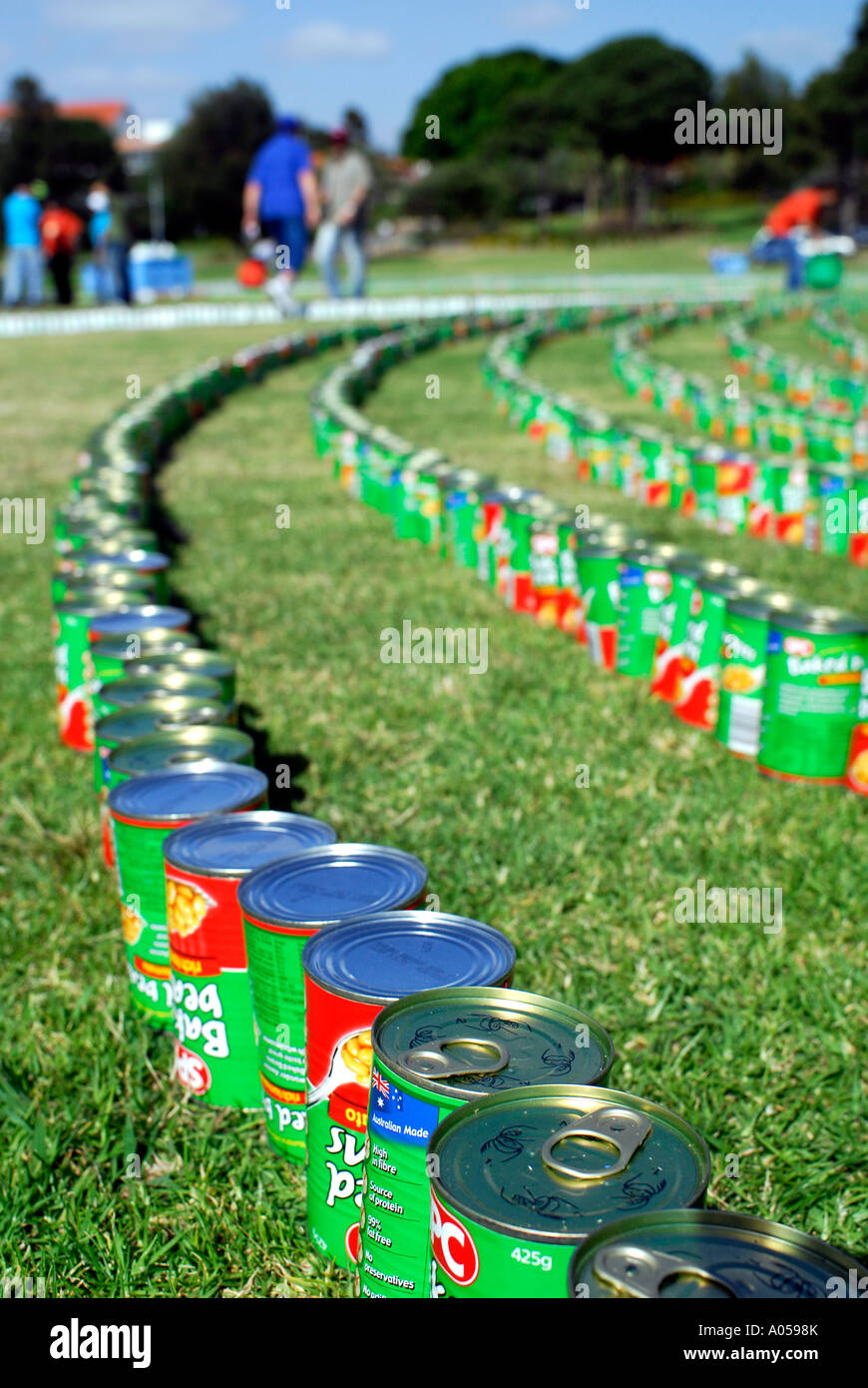 close up of continuous line of cans of baked beans Stock Photo - Alamy