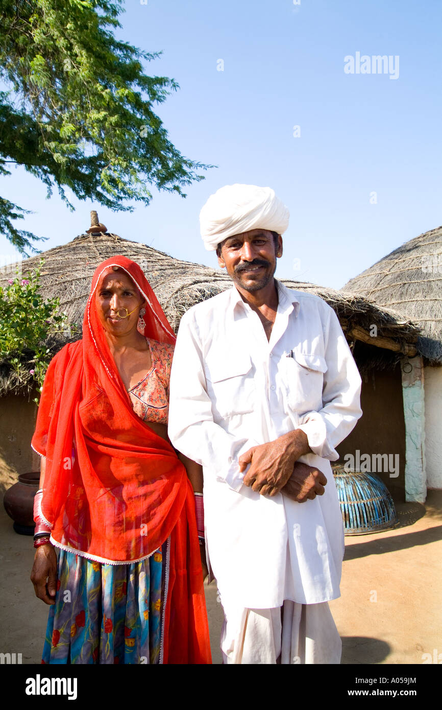 Family portait in front of their poverty vilage near the Great Indian ...