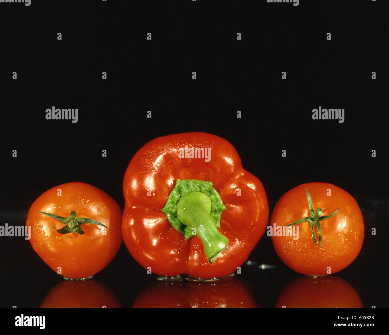 A still life of a red pepper and tomatoes Stock Photo - Alamy