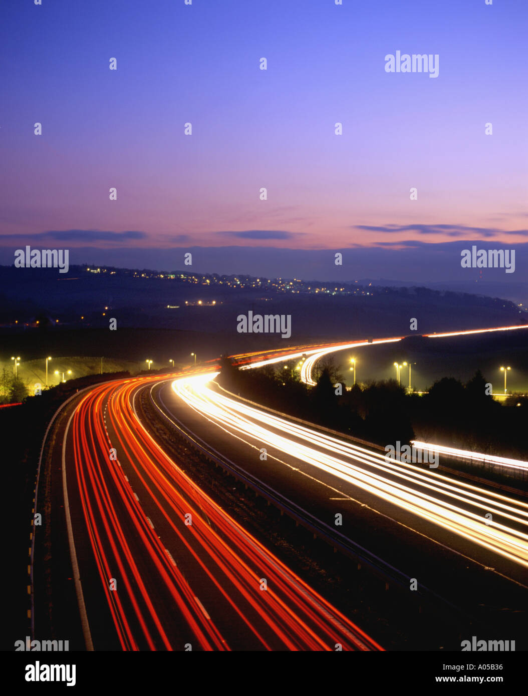 Motorway traffic at dusk; driving on the left Stock Photo - Alamy