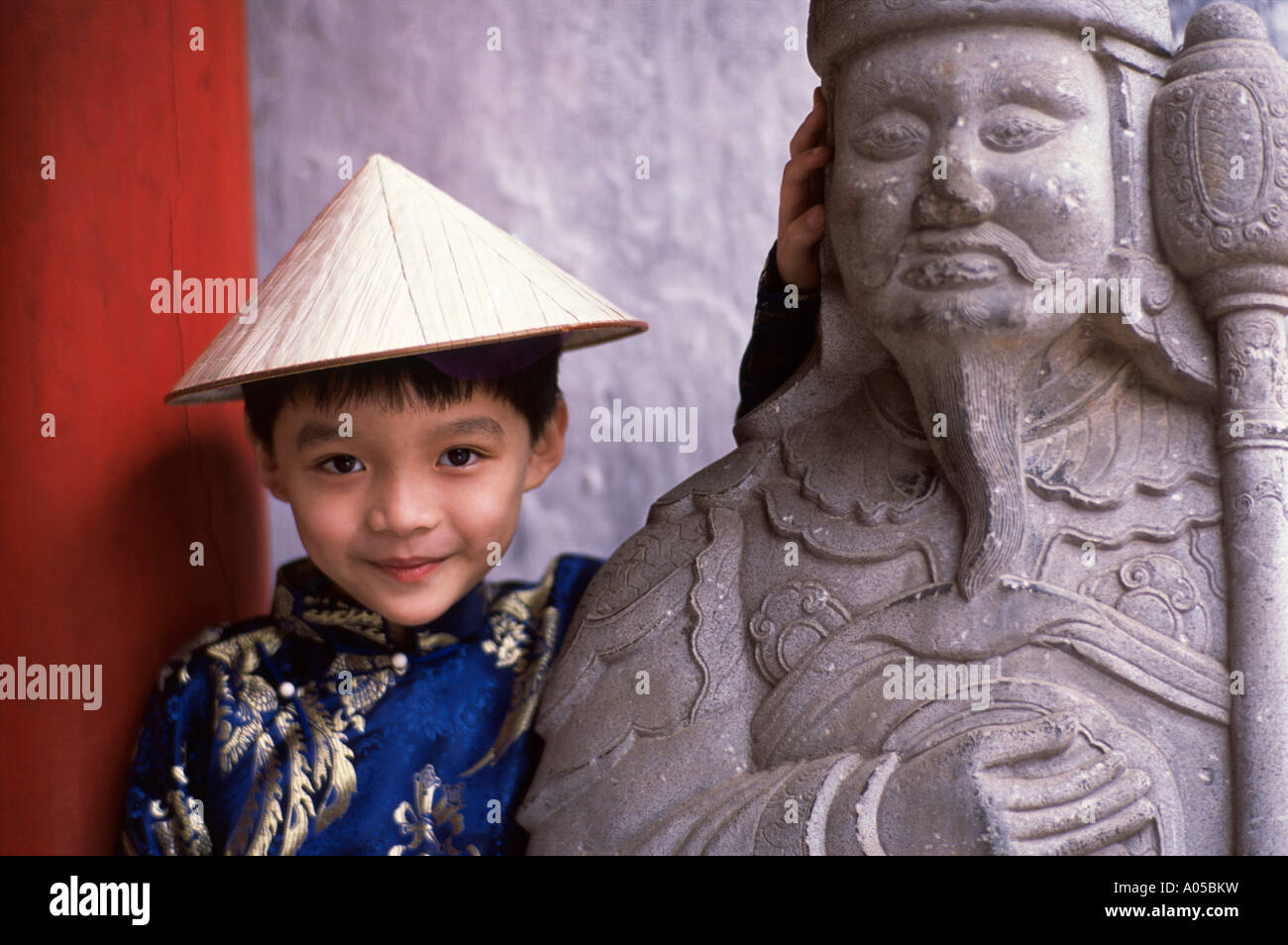 Hanoi, Temple Of Literature, Boy & Statue Stock Photo - Alamy