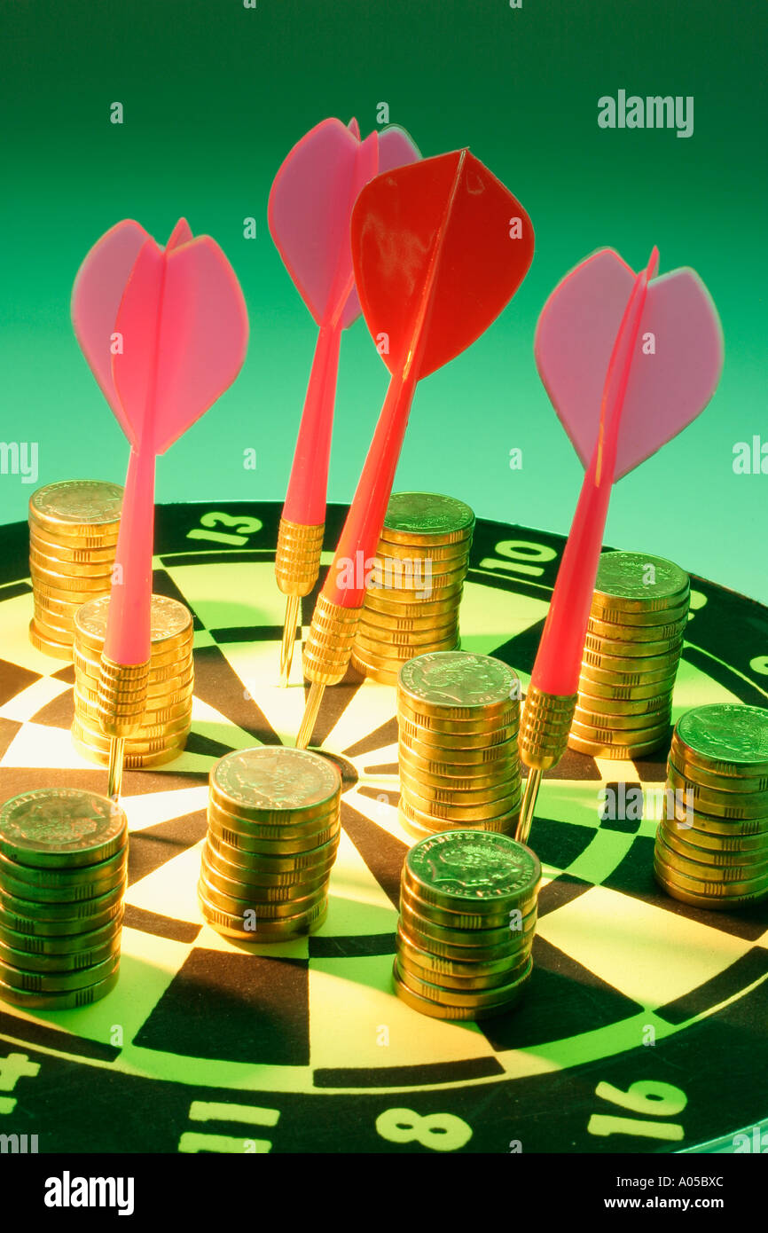 Darts and Stacks of Coins on Dartboard Stock Photo - Alamy