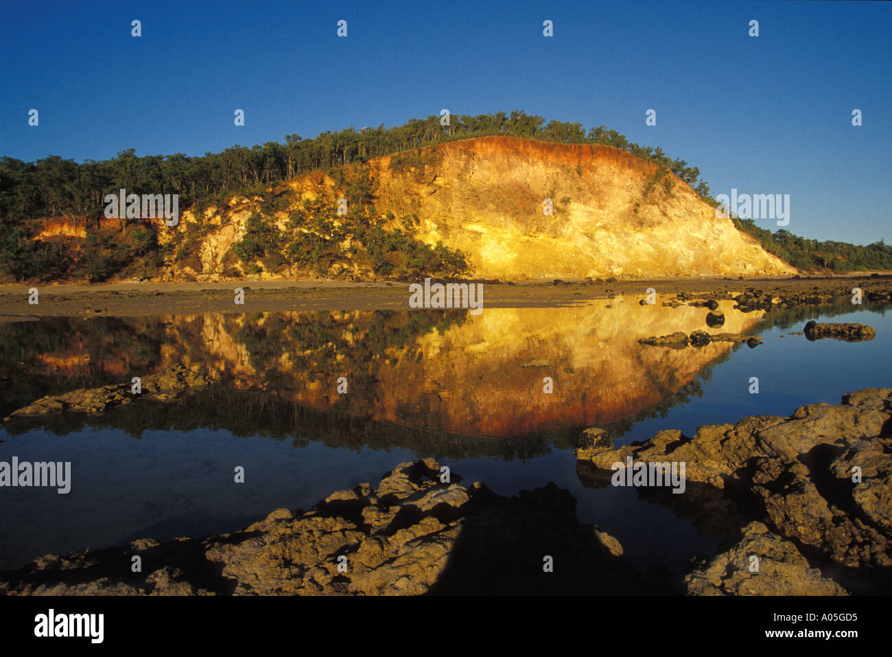Sunrise on inland cliffs reflected in lake seen by the Aborigines as ...