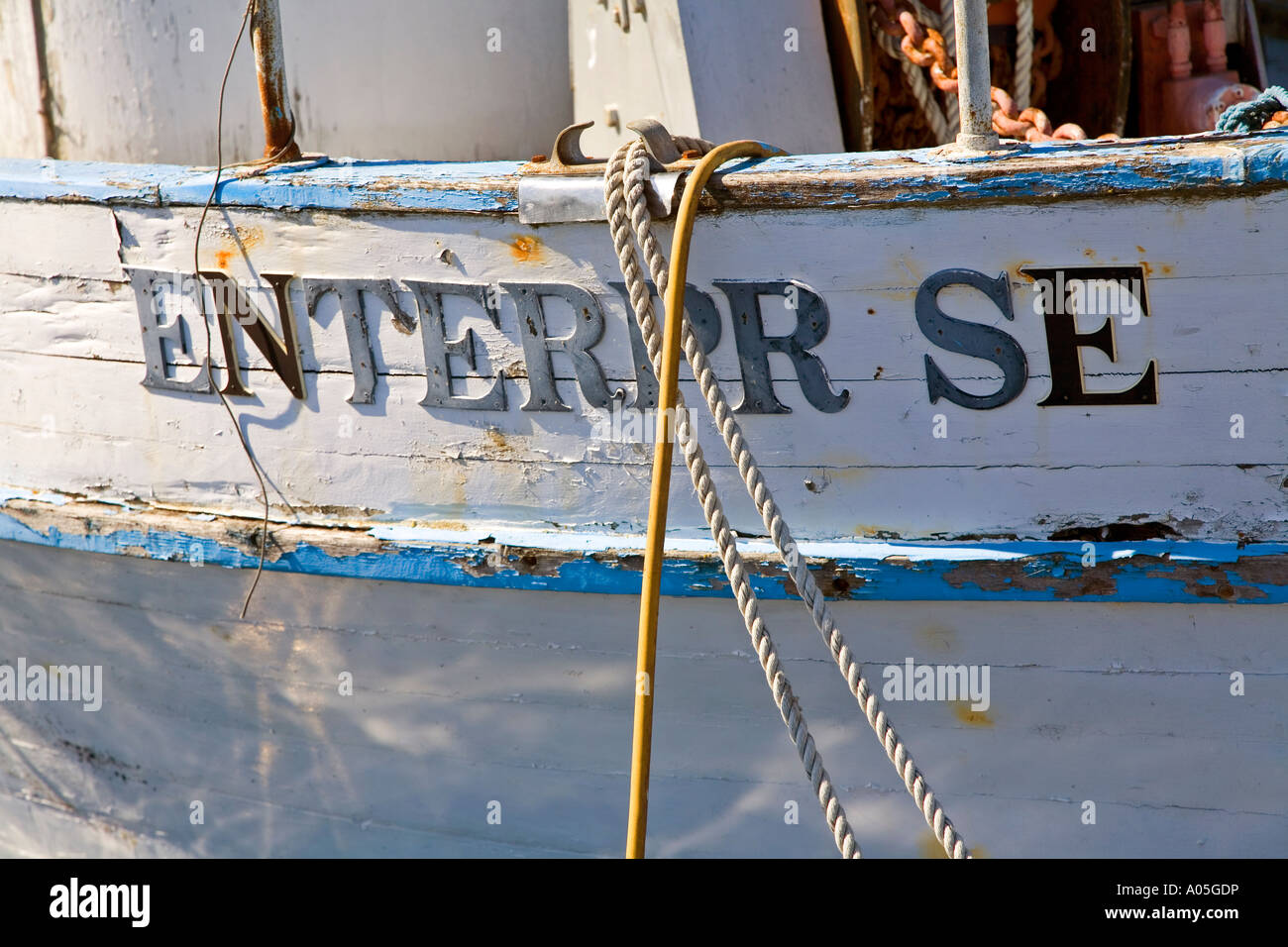 Partly repaired name plate Enterprise on old boat docked in Port of ...