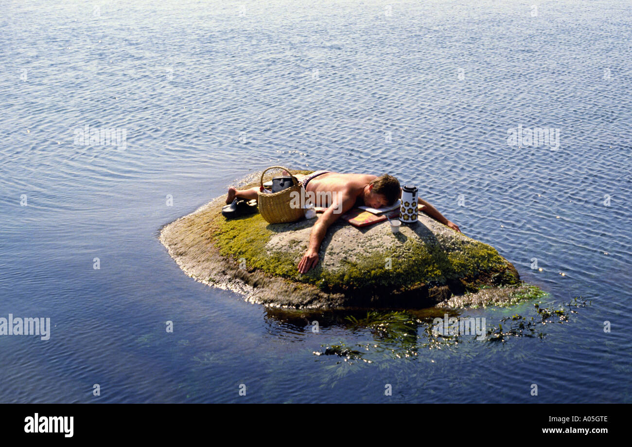 Man sleeping on rocks hi-res stock photography and images - Alamy