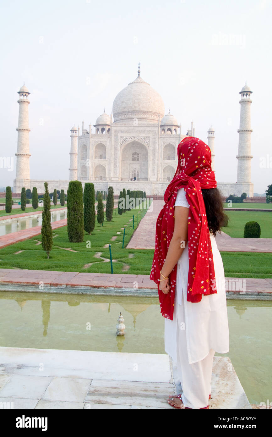 Hindu woman with colorful sari veil in the quiet peaceful Taj Mahal one ...