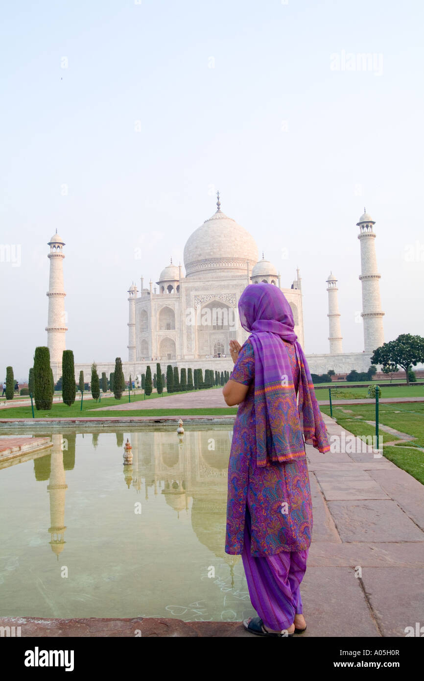 Hindu woman with colorful sari veil in the quiet peaceful Taj Mahal one ...