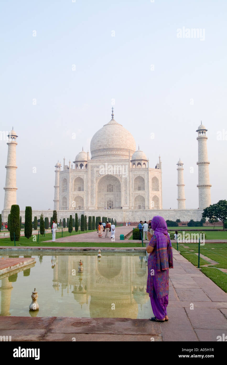 Hindu woman with colorful sari veil in the quiet peaceful Taj Mahal one ...