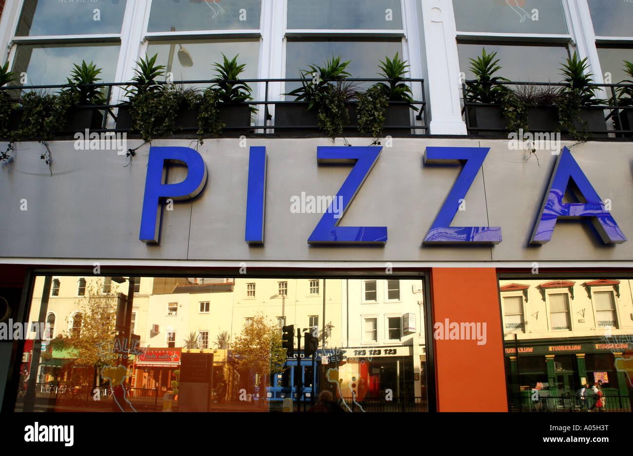 Pizza restaurant sign in London Stock Photo - Alamy