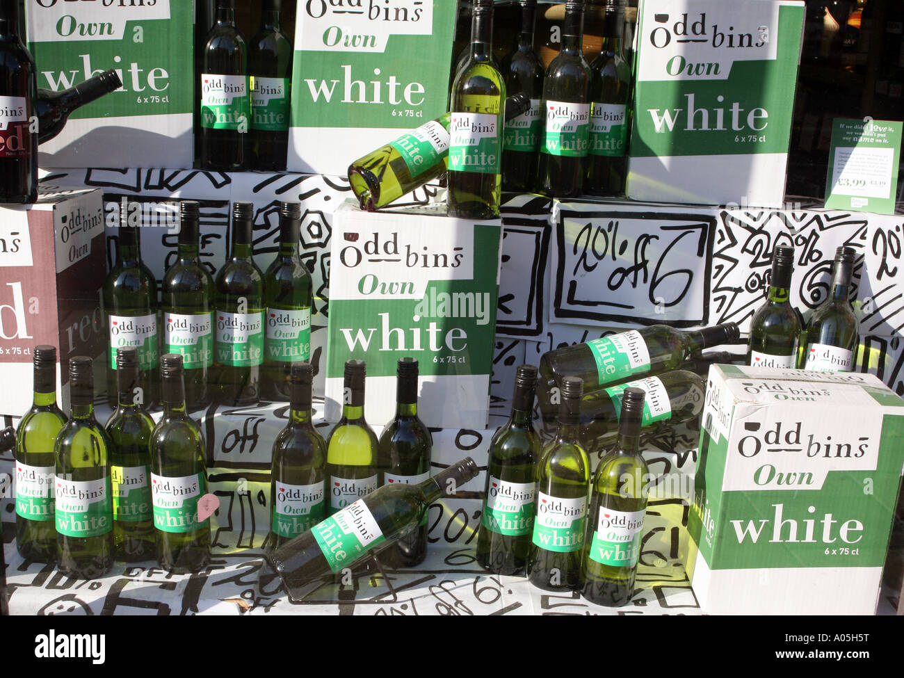 Bottles of wine in window display Stock Photo - Alamy