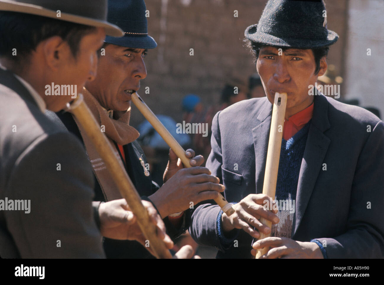 Bolivia Aymara Indians dressed up play pipes and entertain at a village ...
