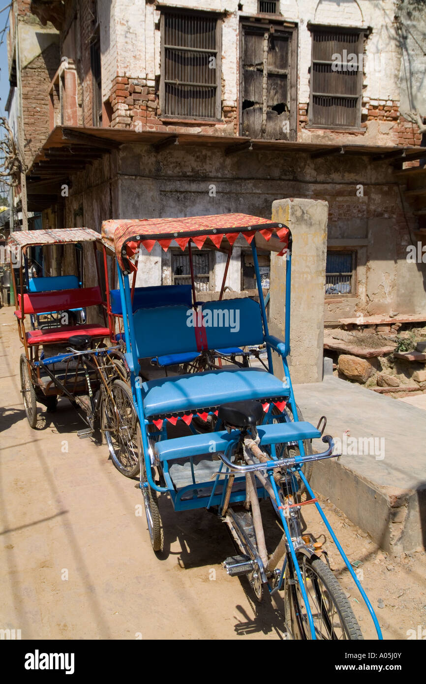 Abstract bicycle rickshaw on rugged street of the religious village of ...