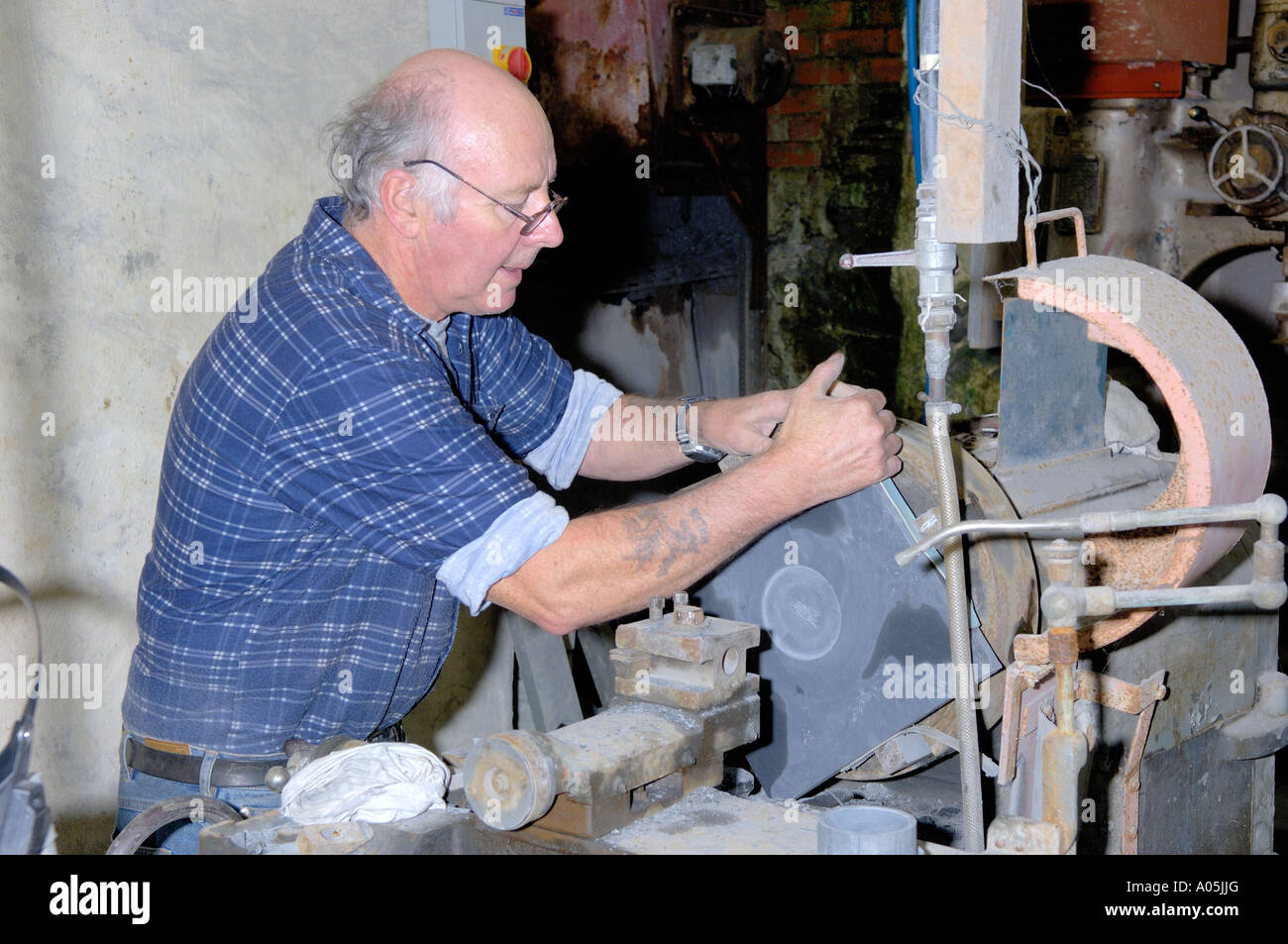 Craftsman Turning a Piece of Slate on Lathe Inside Workshop Inigo Jones ...