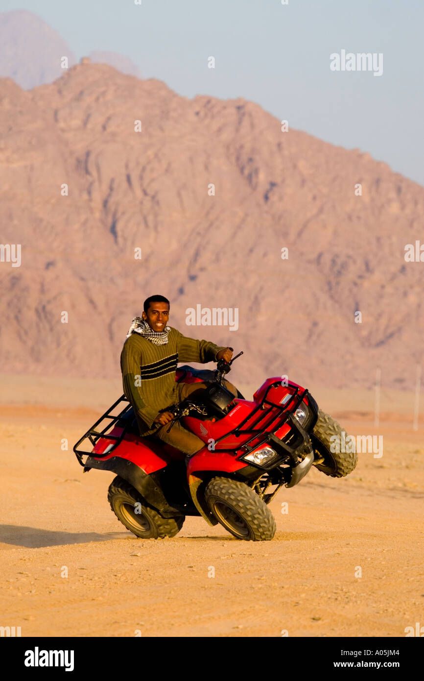Egyptian Man riding quad bike Stock Photo - Alamy