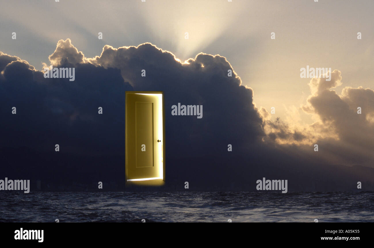 A door opening in dark clouds with sun rays coming out from behind the ...