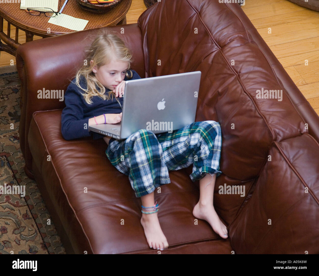Child working on a laptop Stock Photo - Alamy