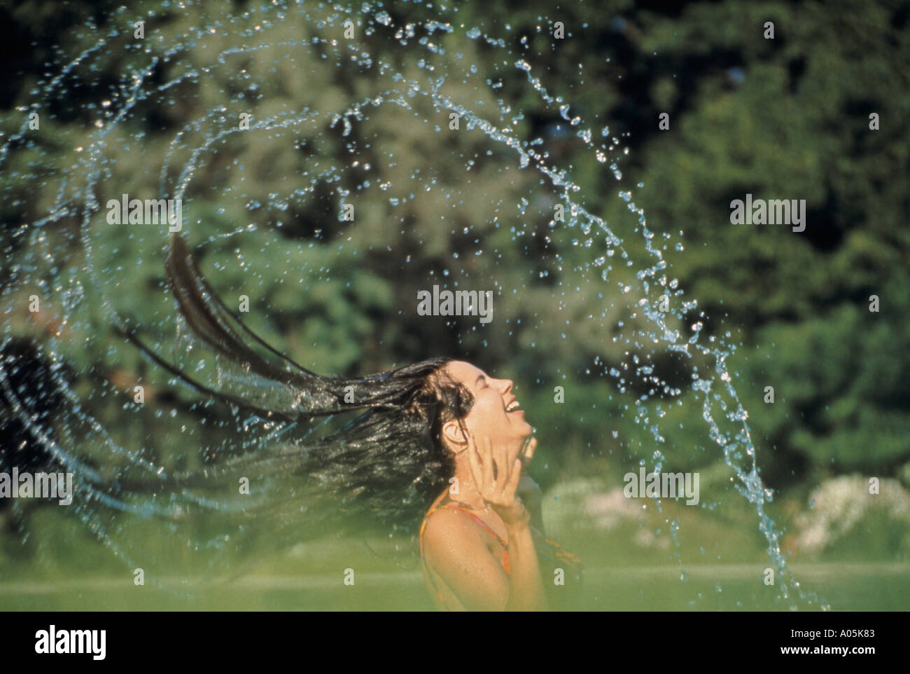Woman emerging from pool hi-res stock photography and images - Alamy