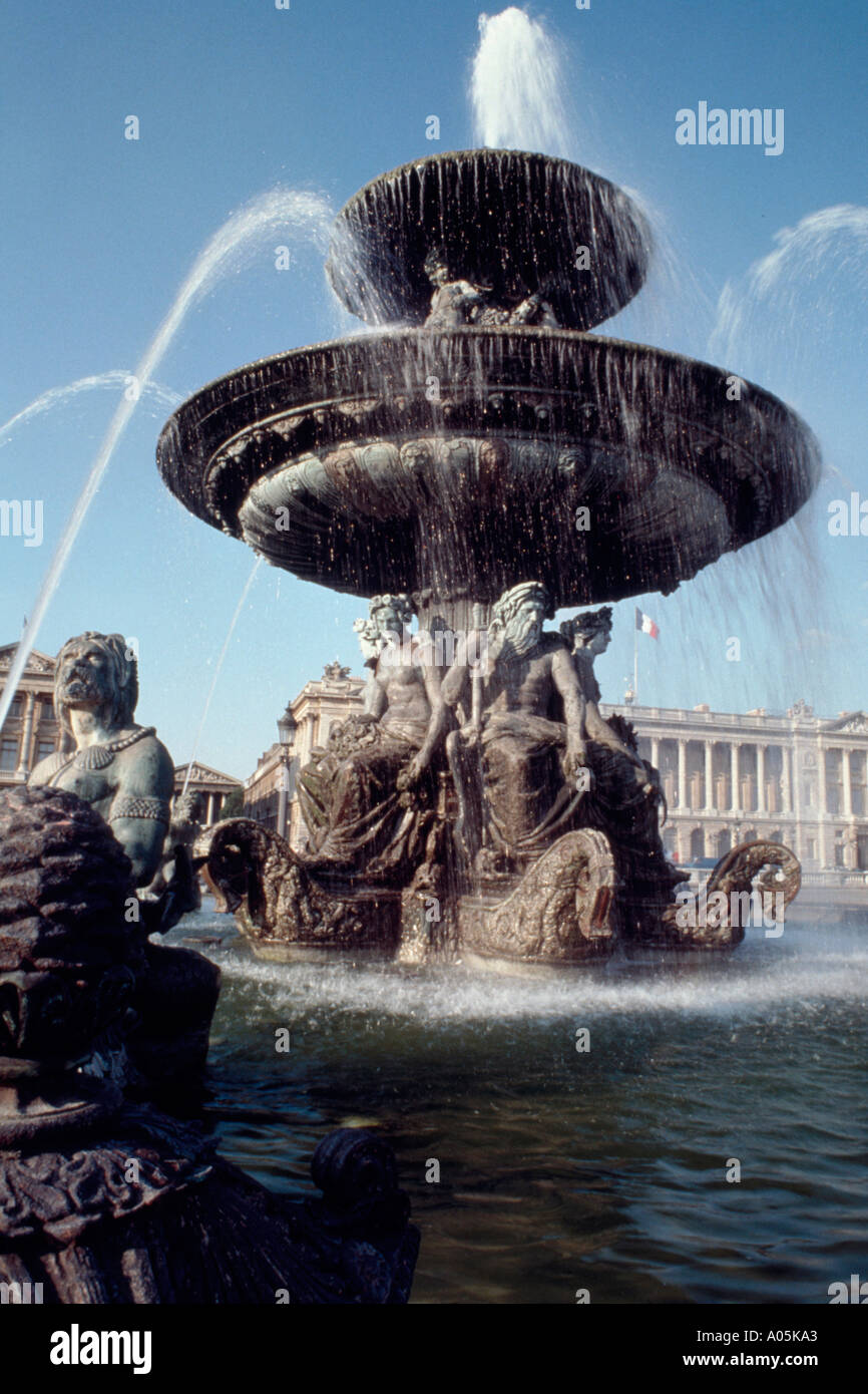 Water is flowing through an elaborate fountain on the Place de la ...