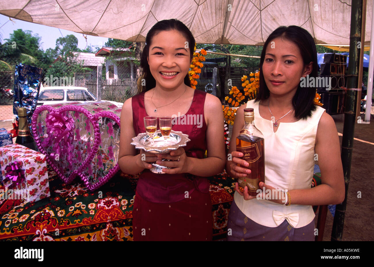 Welcome drink at a Lao wedding. Vientiane, Laos Stock Photo - Alamy