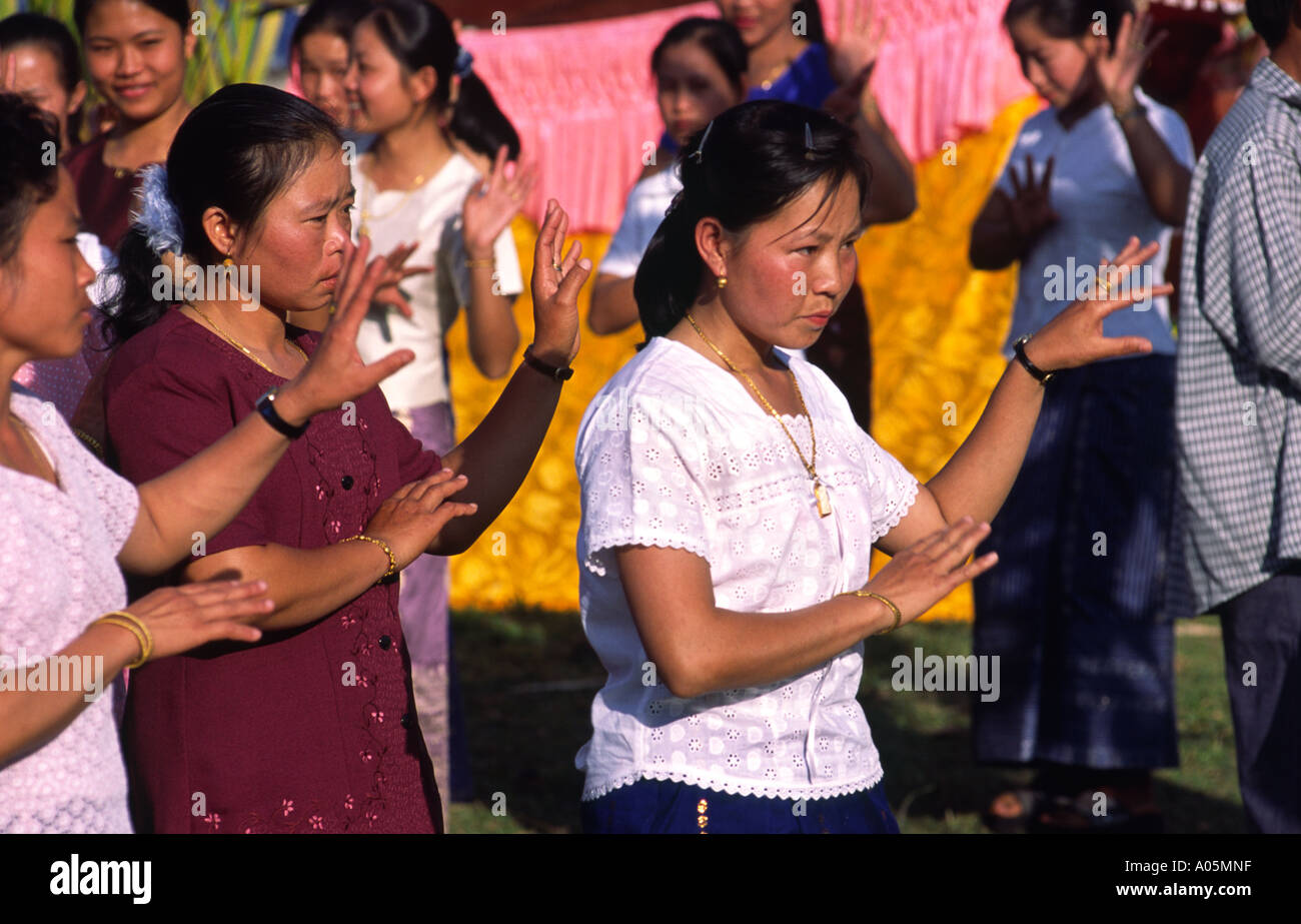 Traditional Lam Vong dance at the temple fair. Muang Sing, Luang Nam ...