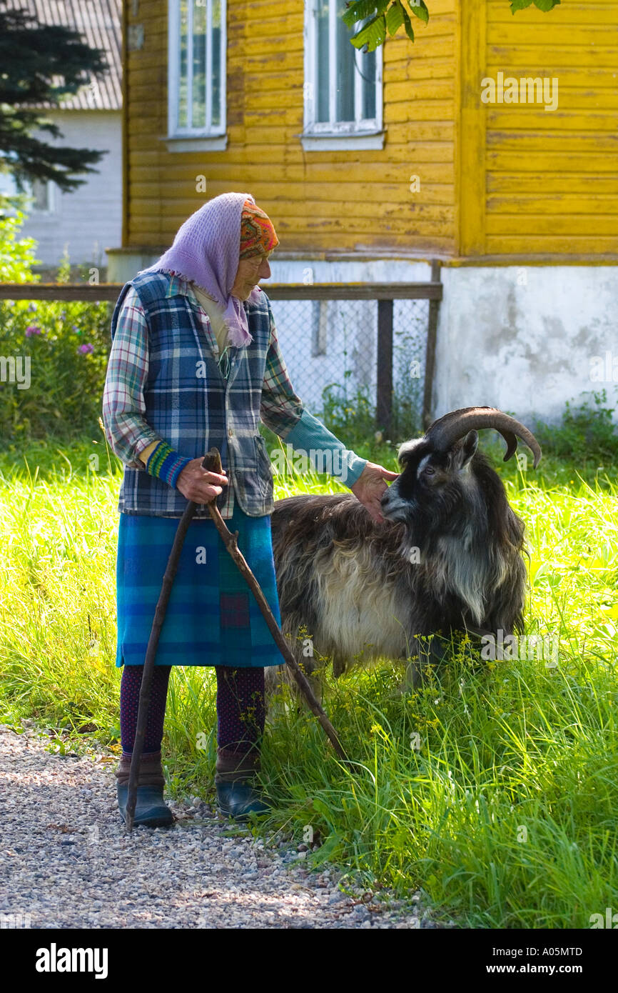 Old woman and billy goat Stock Photo - Alamy