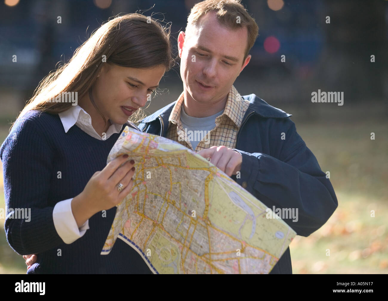 boy and girl looking at map for directions Stock Photo - Alamy