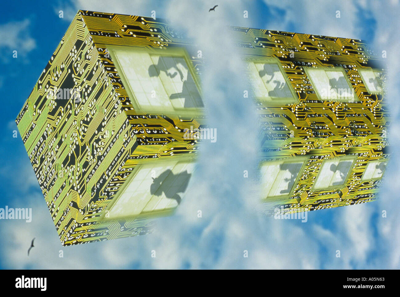 Silhouette of business people in a digitally created sky scraper that ...