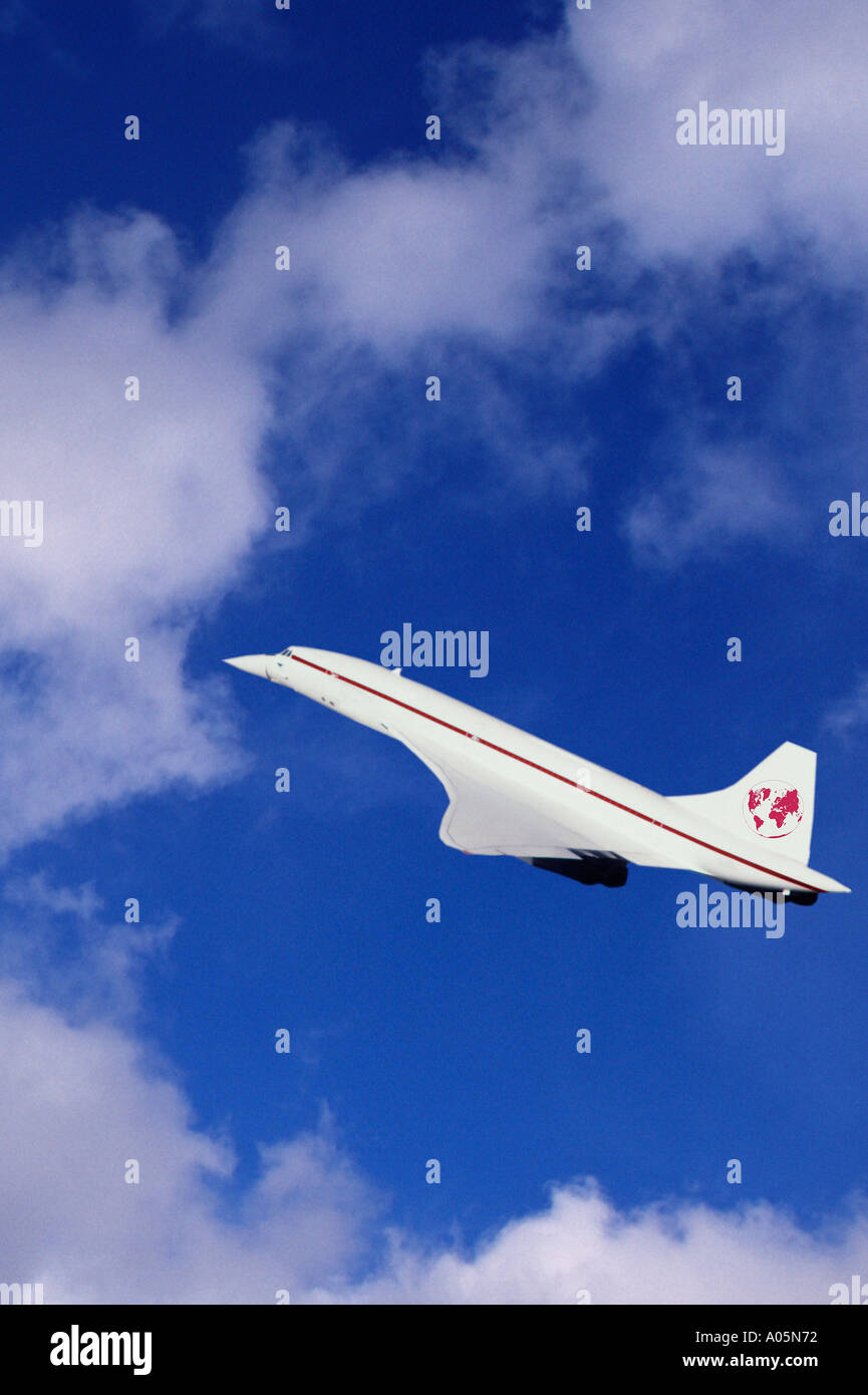 Concorde in flight ascending into blue sky and clouds Stock Photo - Alamy