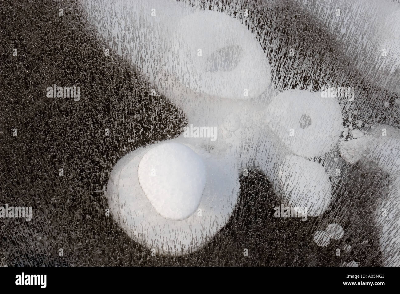Face formed of snow and air bubbles trapped underneath ice , Finland ...