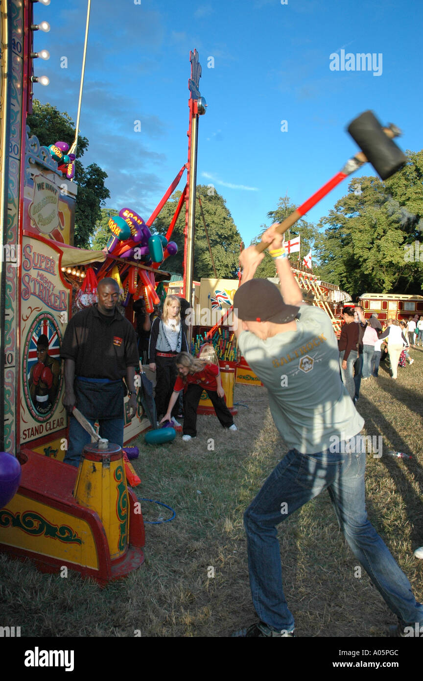 Muscle strength test hammer swinging swing hit hitting bell ring hi-res ...