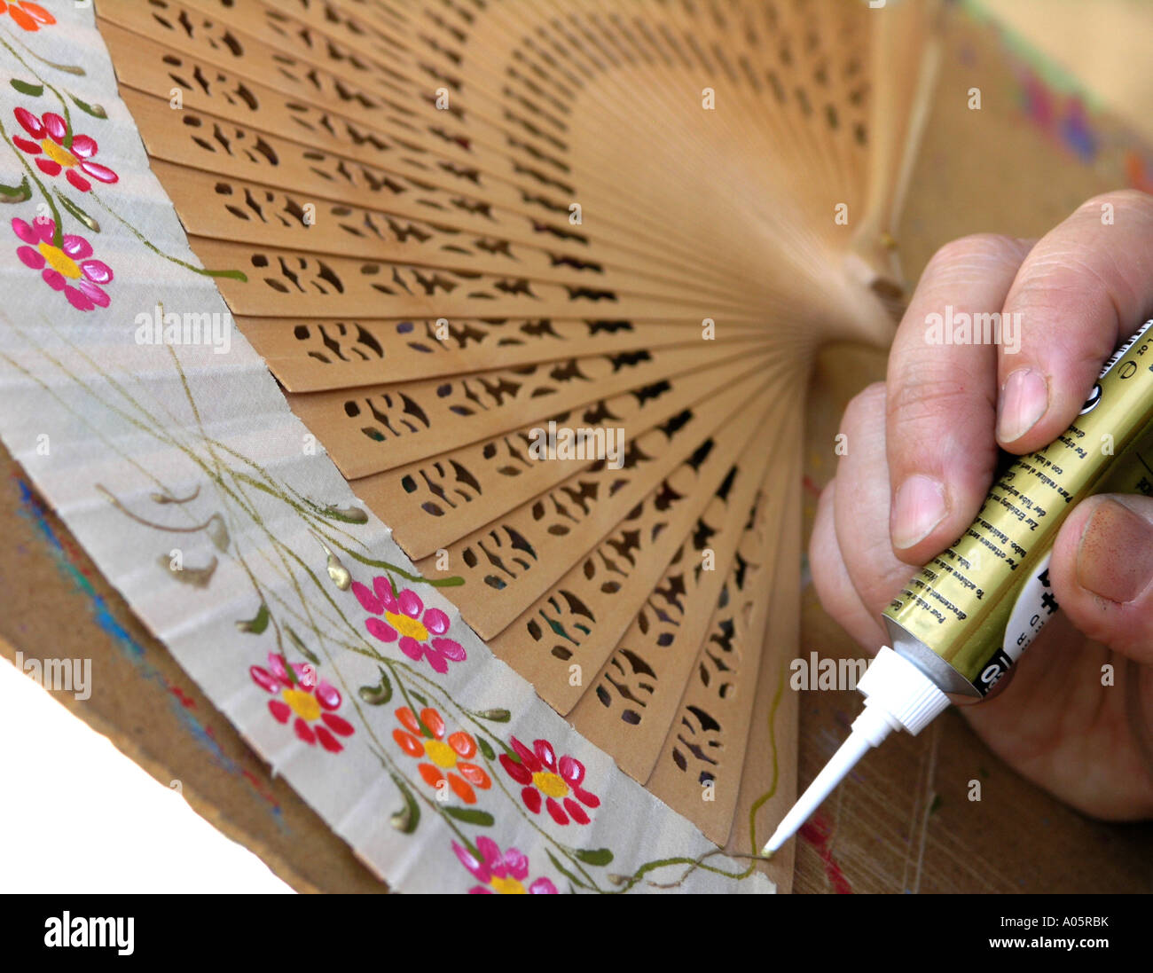 Spanish fan being decorated close up Stock Photo - Alamy