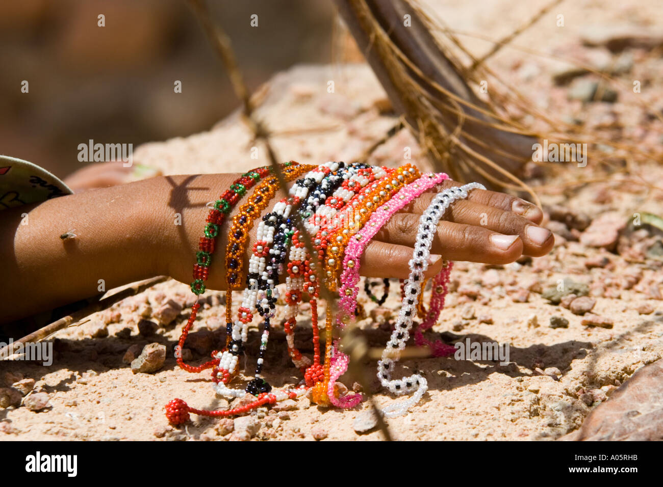 Hand with armlets Stock Photo - Alamy