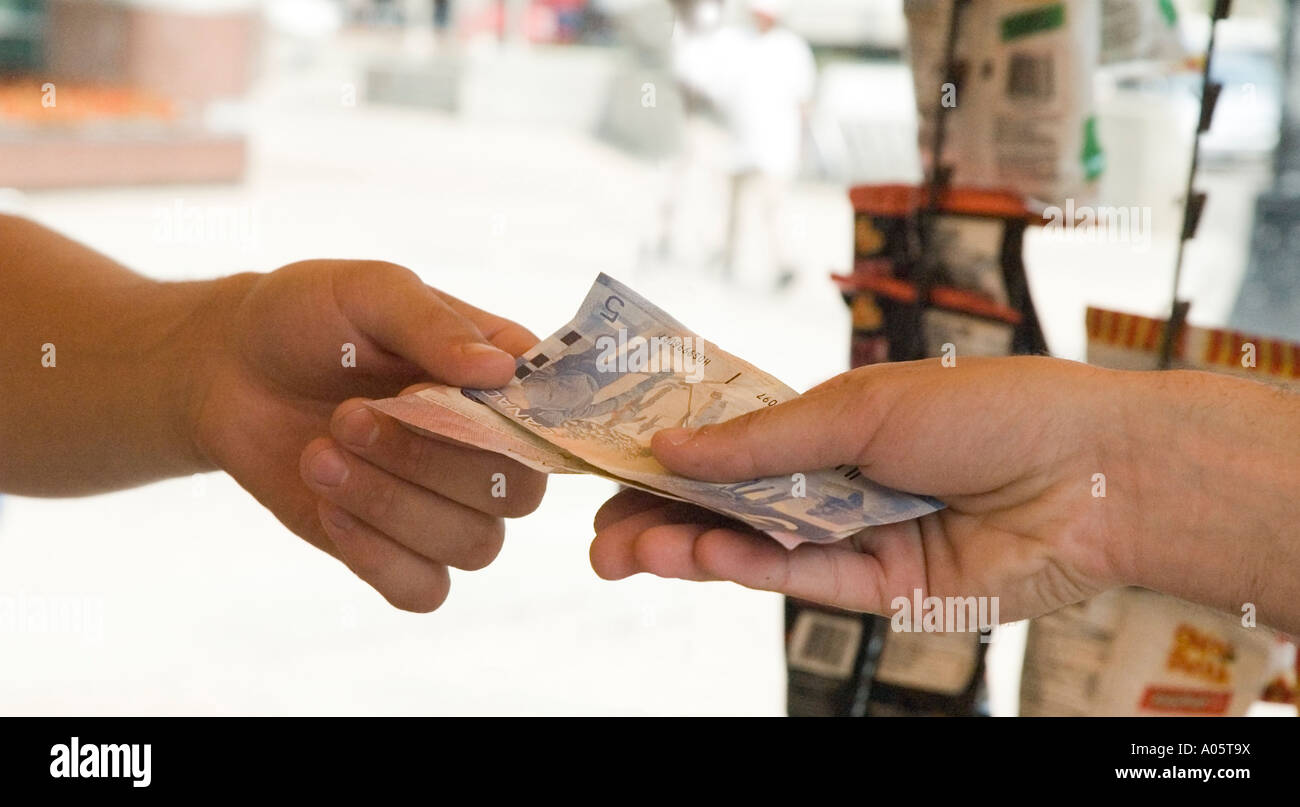 a successful transaction between 2 men, exchanging paper money Stock ...
