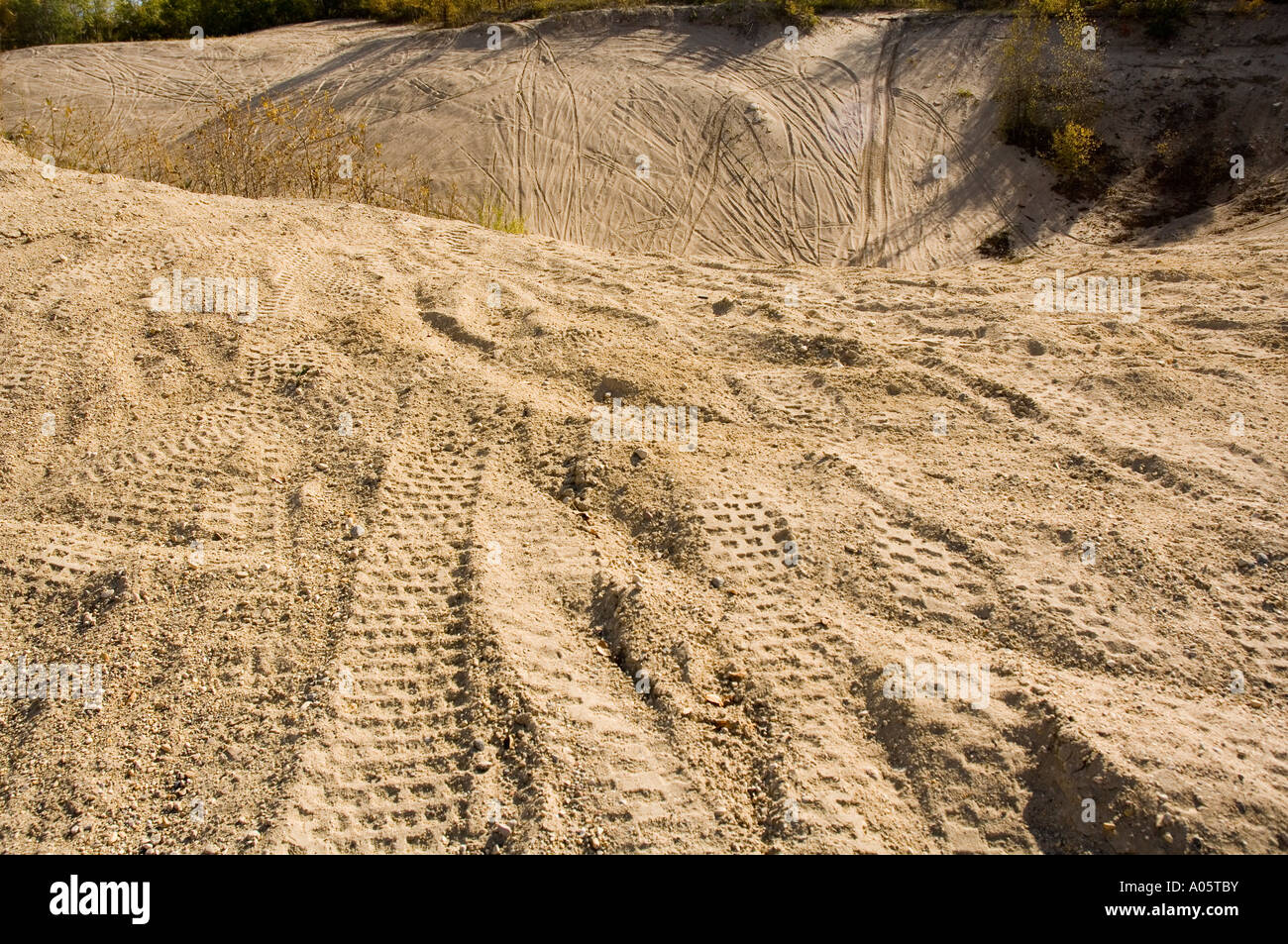 Down hill all the way with all terrain vehicle tracks in the sand Stock ...