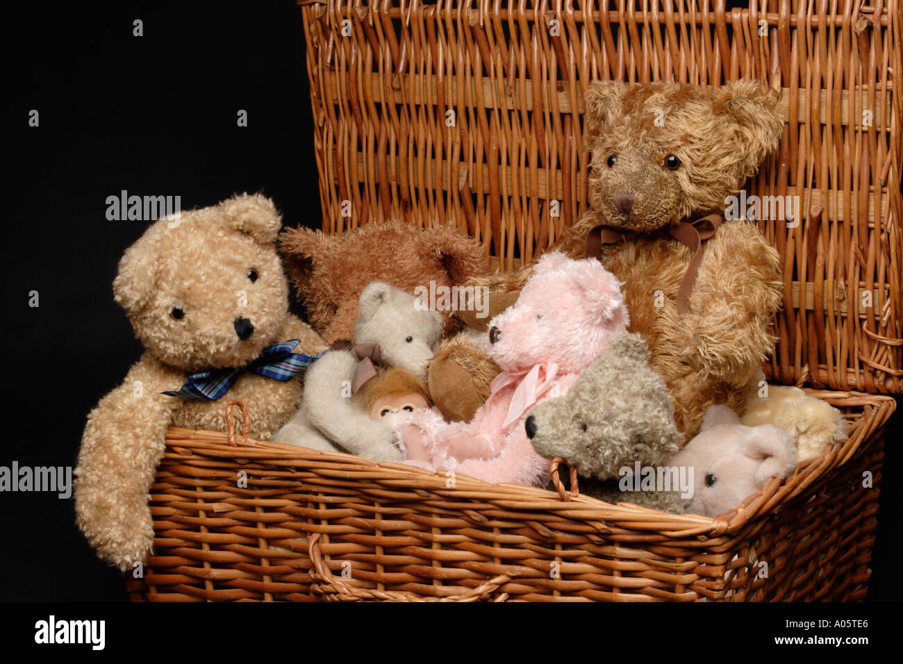 Childhood toys basket full of teddy bears Stock Photo - Alamy