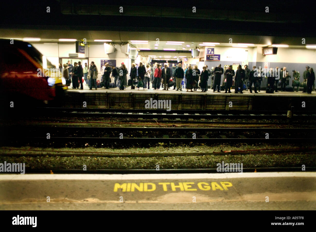 Passengers standing queue railway platform hi-res stock photography and ...