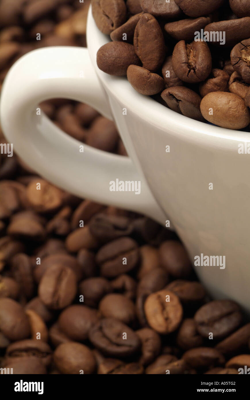 Cup Filled with Coffee Beans Stock Photo - Alamy