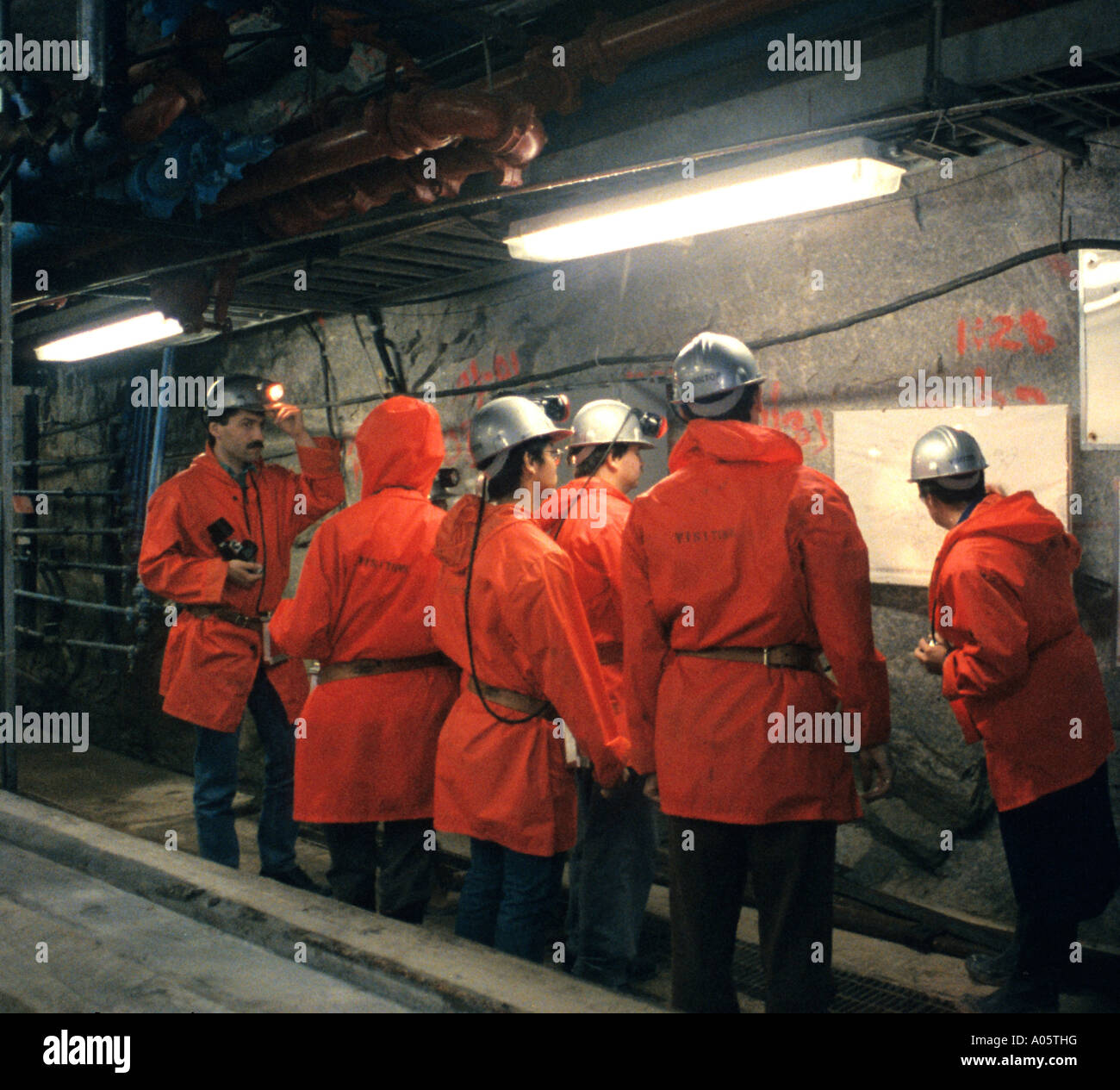 Mining crew in an underground mine plan a new project Stock Photo - Alamy