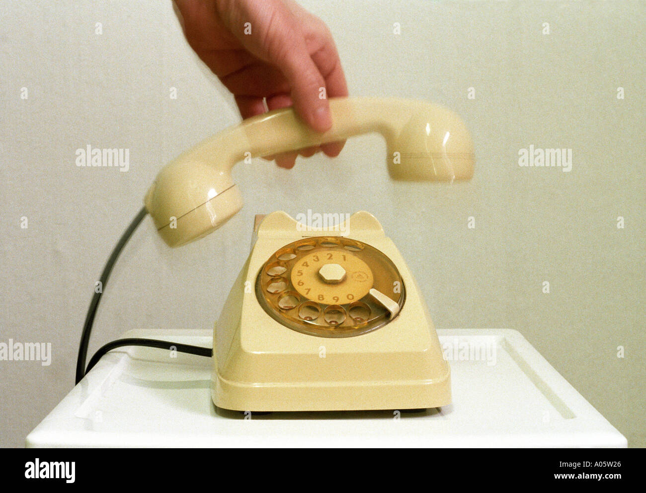 hand raising a telephone receiver Stock Photo - Alamy