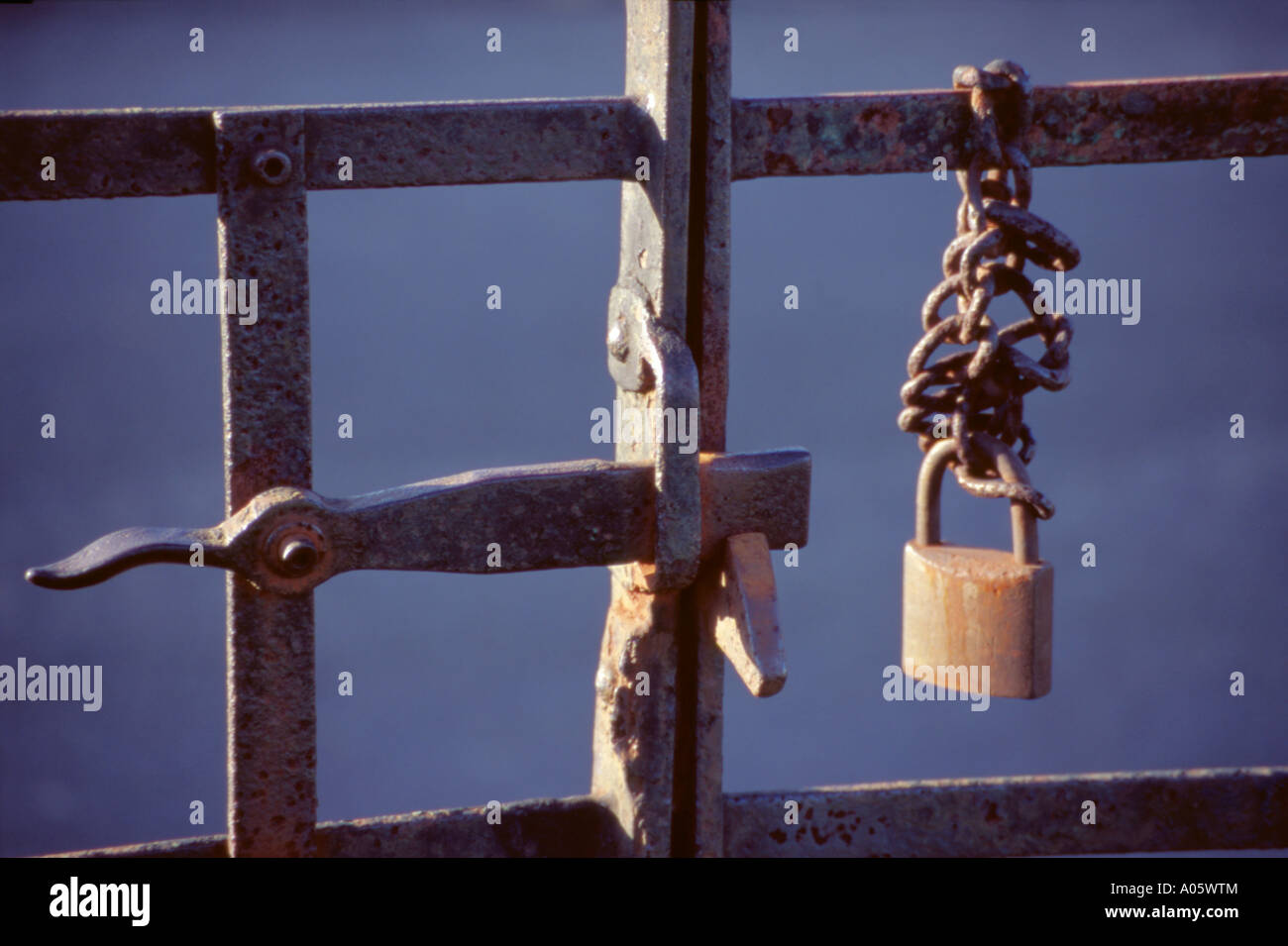 Corroded metal gate with padlock and chain Stock Photo - Alamy