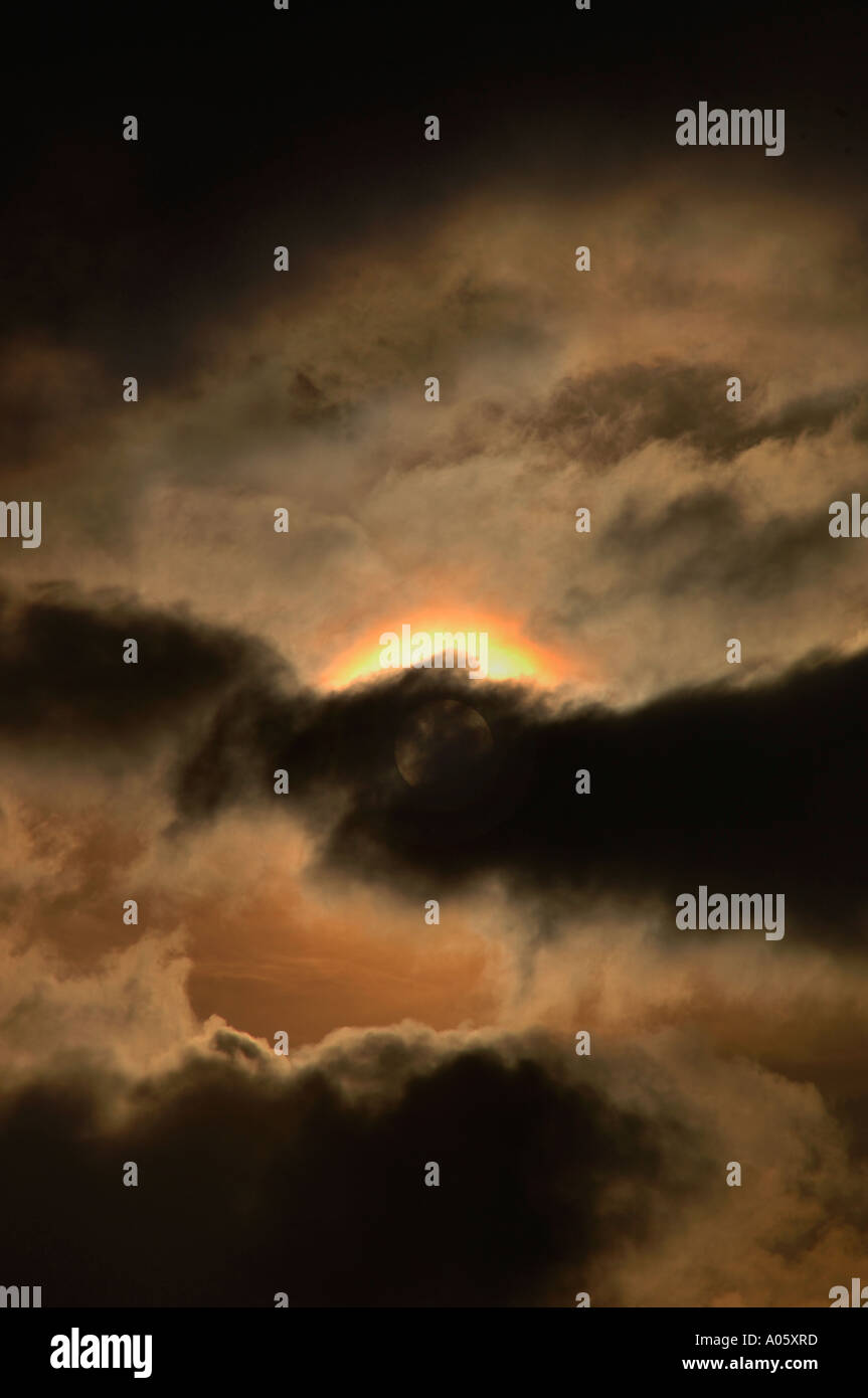 The Sun Backlighting Clouds In An Evening Sky Stock Photo - Alamy