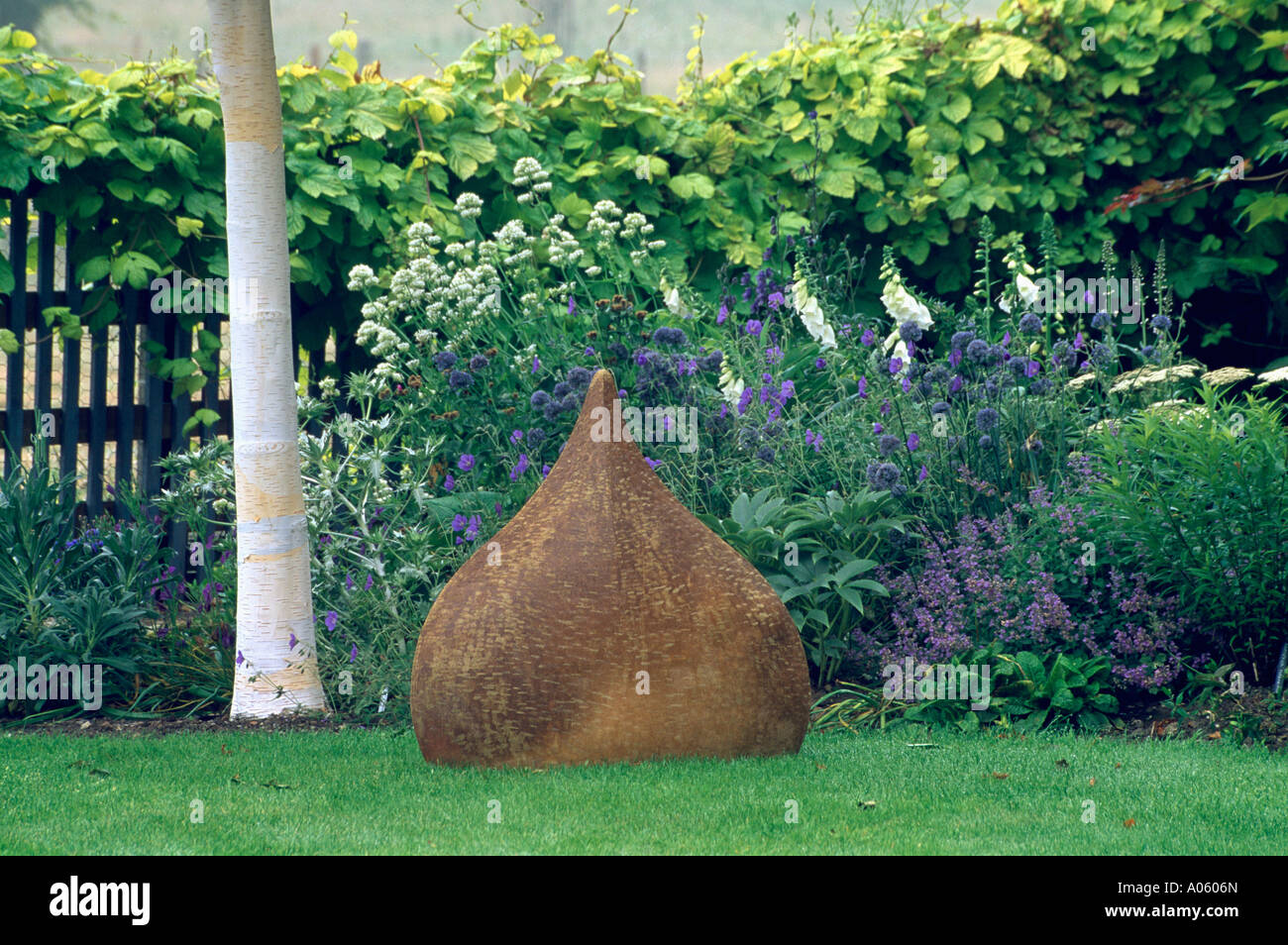 Terracotta sculpture and white birch tree Stock Photo - Alamy