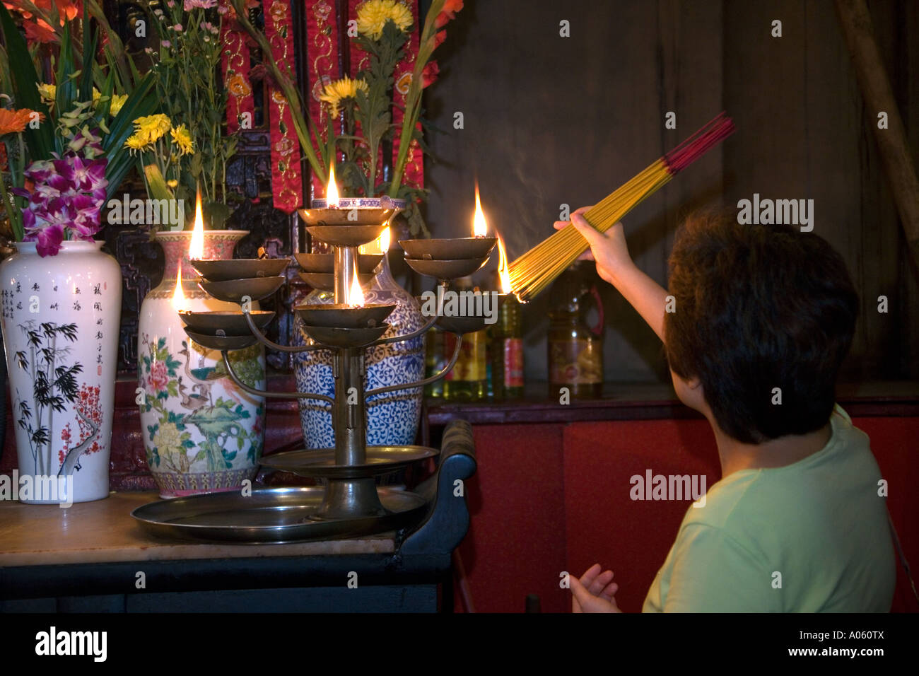 Local Chinese woman praying in the Man Mo temple in Hong Kong Stock ...