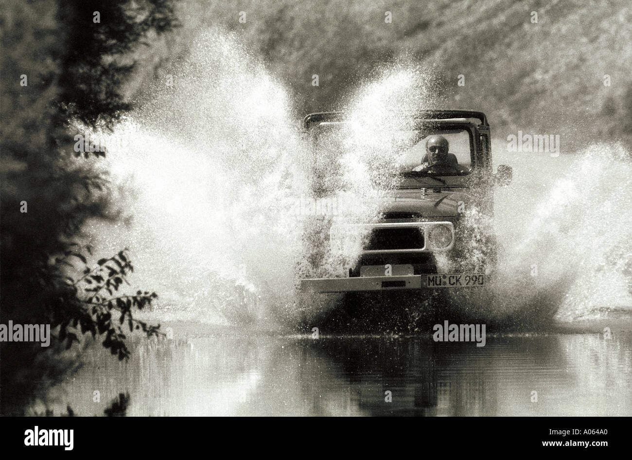 Toyota Landcruiser jeep going through water Stock Photo - Alamy