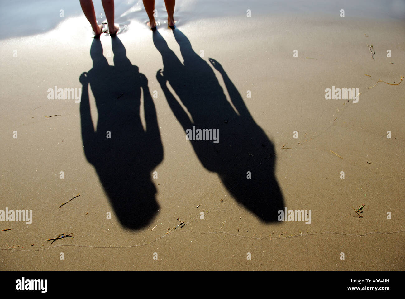 Silhouette standing feet together hi-res stock photography and images ...