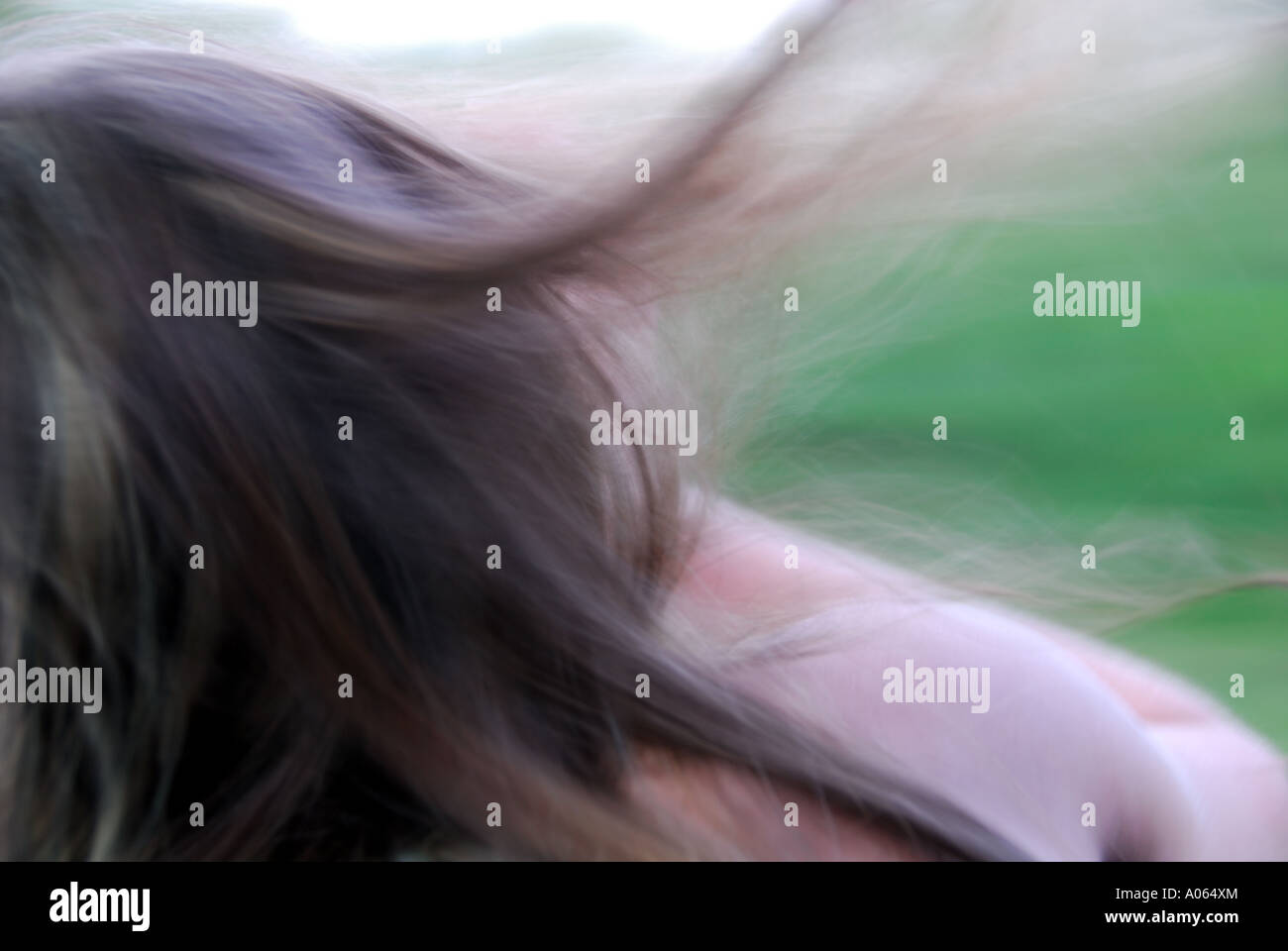 teenage girl leaning out of car window with hair blowing Stock Photo ...