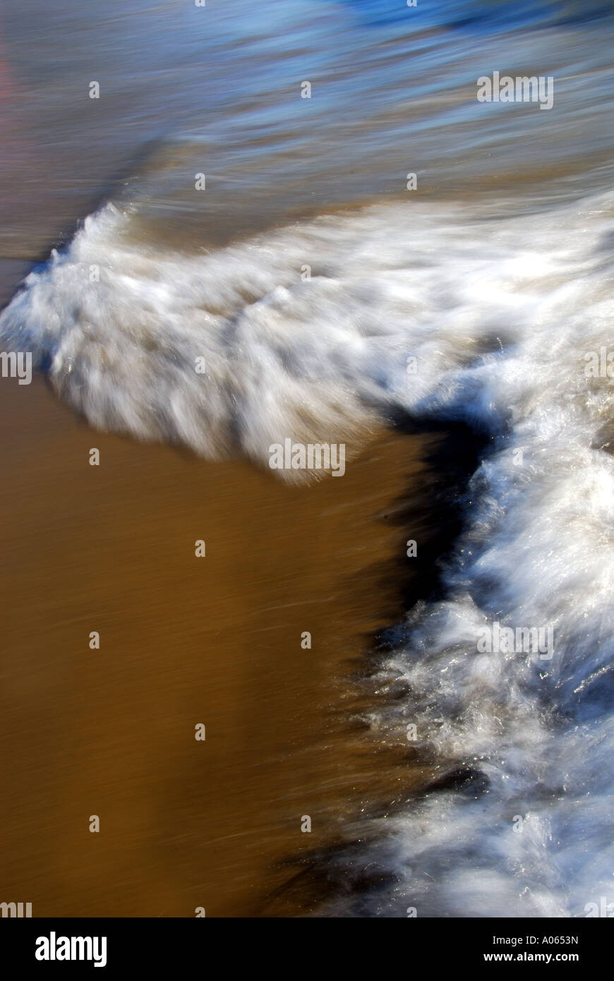 Sea water moving onto sandy hi-res stock photography and images - Alamy