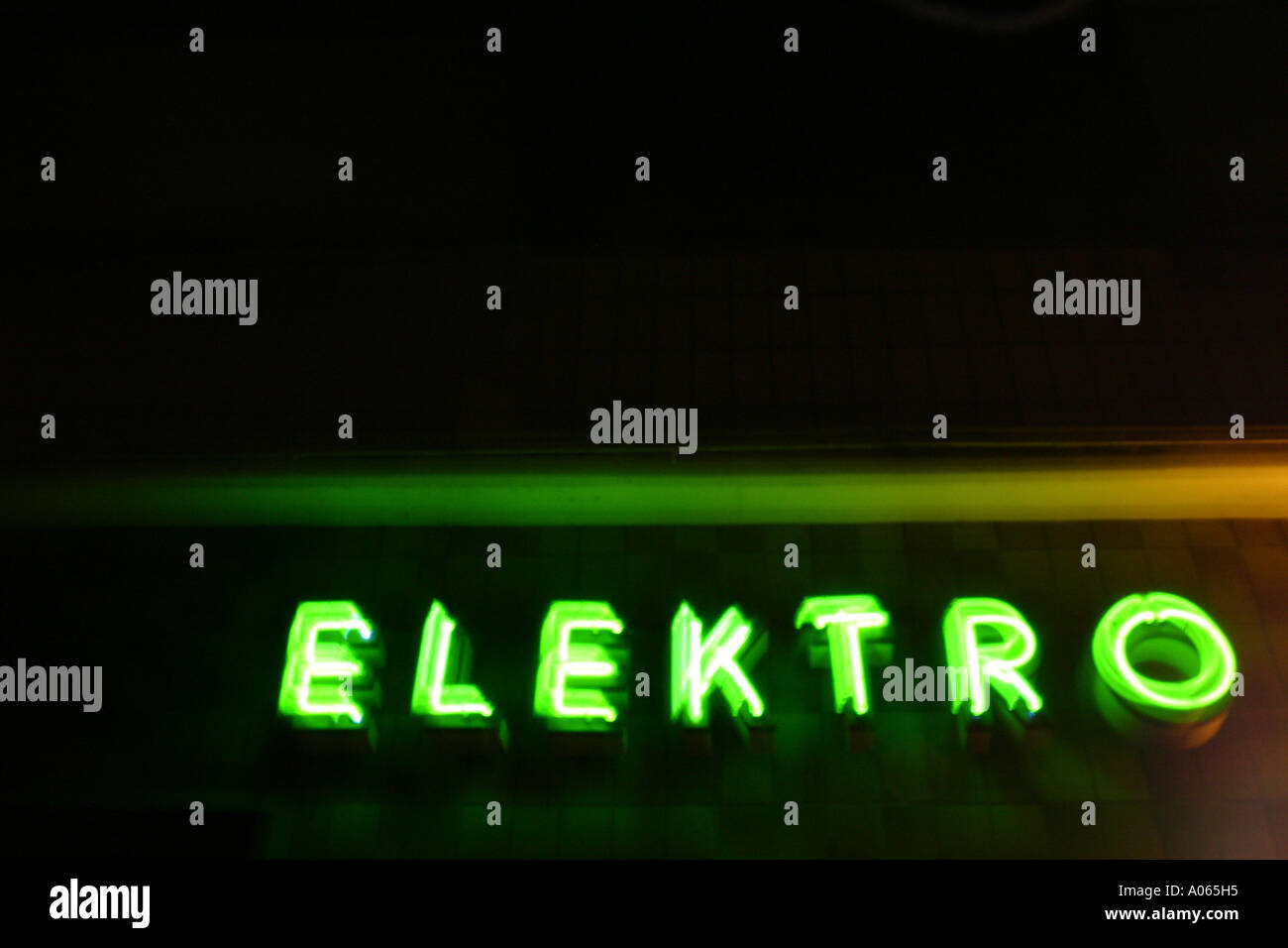 Fluorescent green word glowing in the dark Stock Photo - Alamy