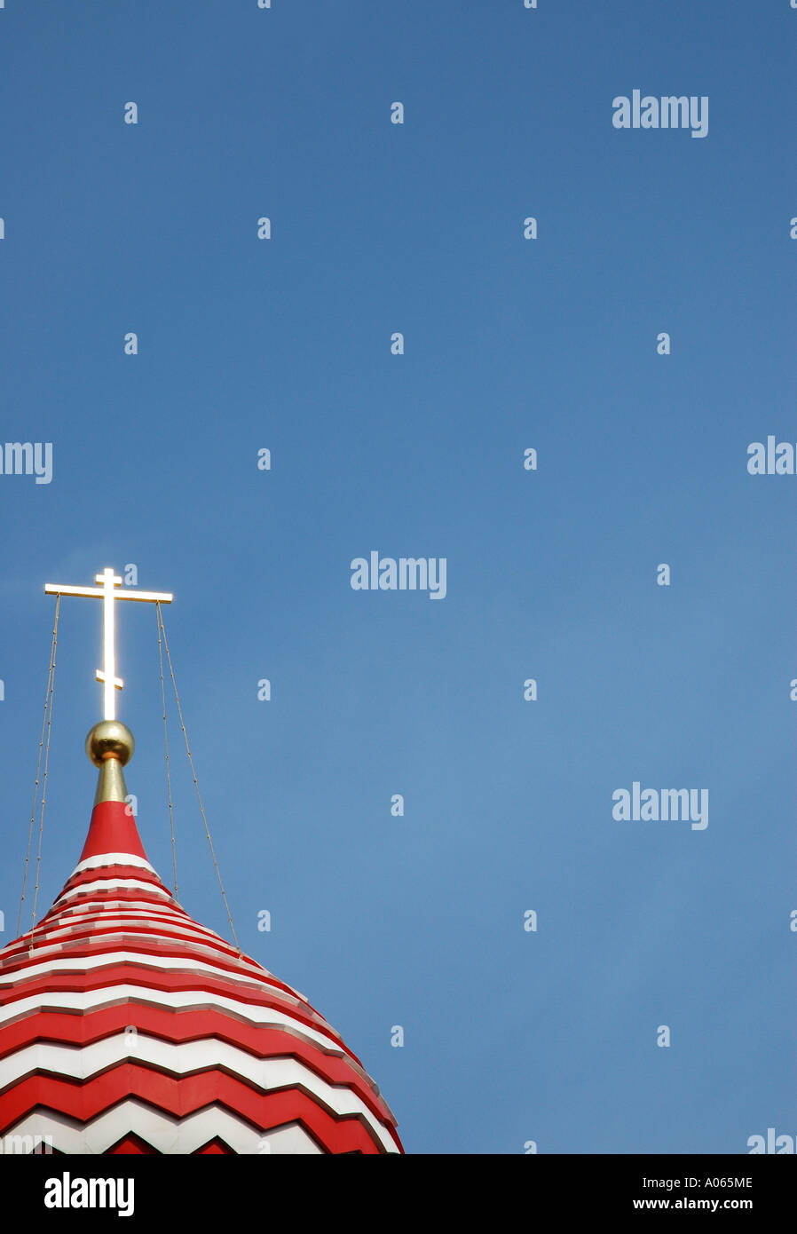 Cross placed on top of a red and white striped steeple Moscow Stock ...