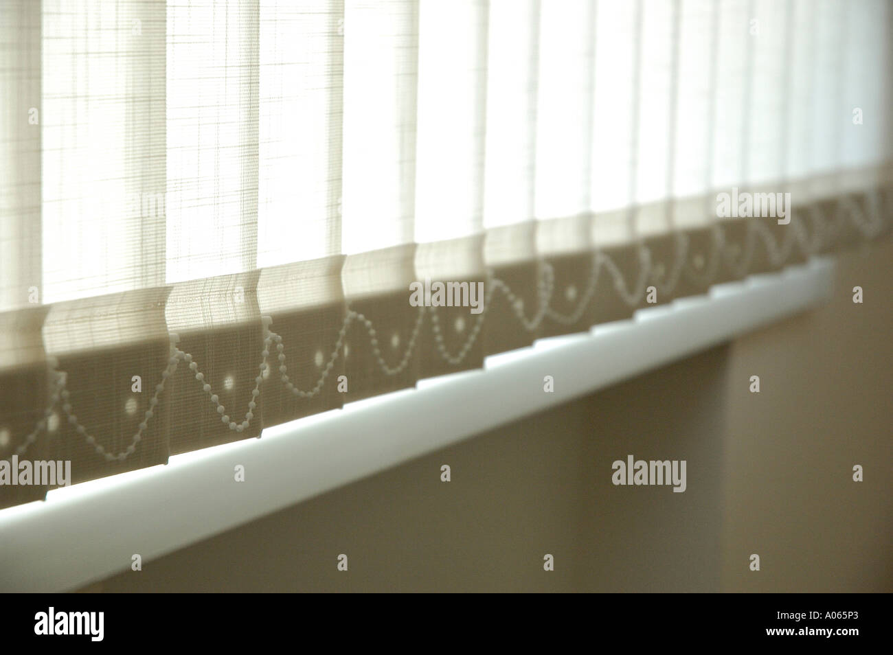 Side view of an elegant curtain is seen with beads attached at its ...